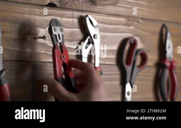 A close-up video of a carpenter putting a tool on its place. Equipment ...