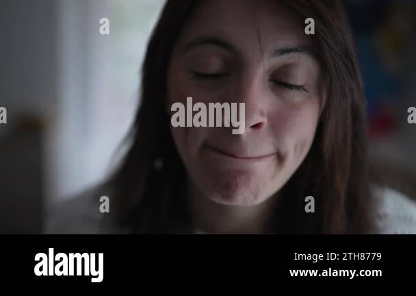 Woman changing emotion pressing lips becoming serious. Portrait face ...