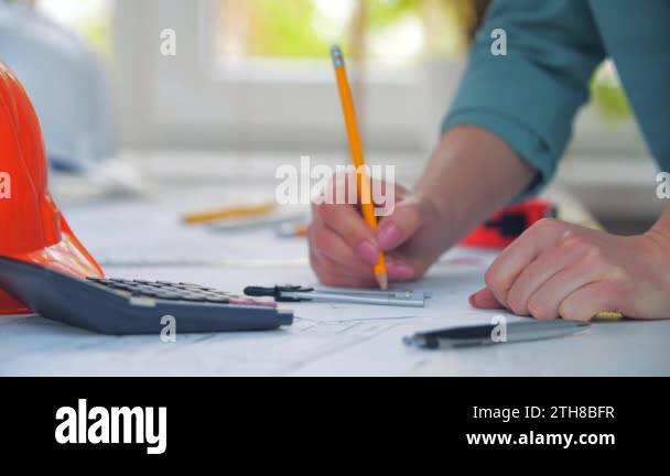 4k video of close up engineer hand sketching a construction project ...