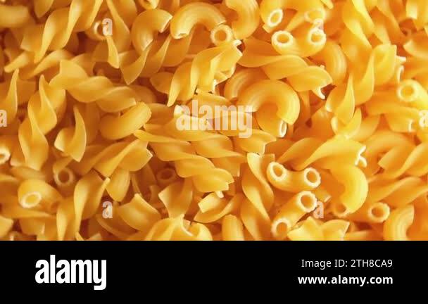 Uncooked Fusilli and Chifferi Rigati Pasta - Top View, Close-Up. Fat ...