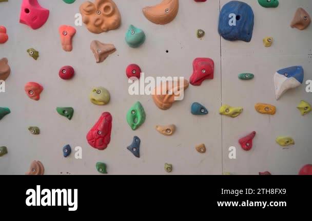 Climbing artificial rock climbing wall to practice mountain bouldering ...