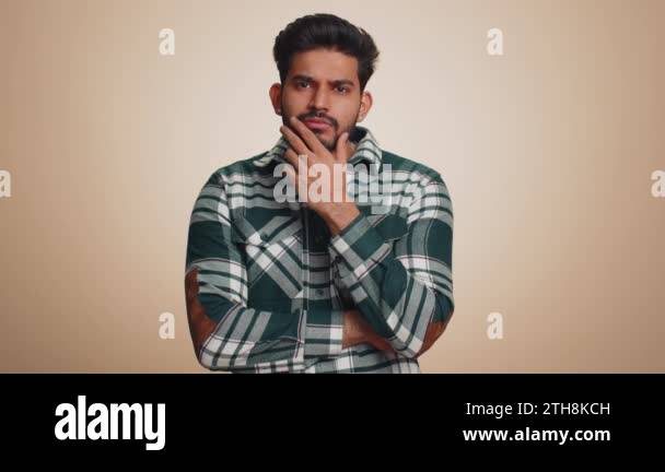 Eureka. Inspired young indian man pointing finger up with open mouth ...