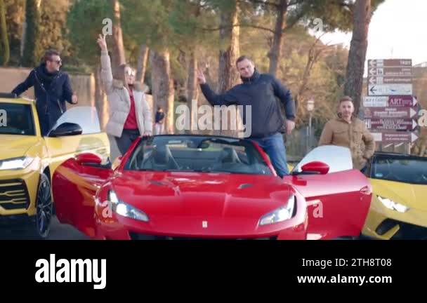 ROME, ITALY - NOVEMBER 7, 2022: Young rich people posing on camera ...