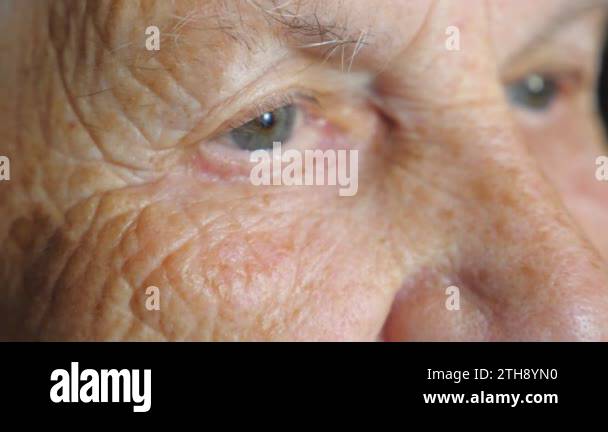 Portrait Of Elderly Woman Watching Pensive To Something Close Up Of