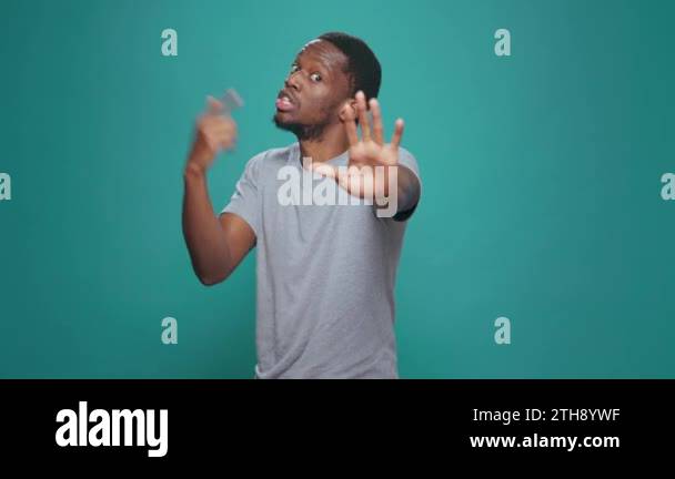 Portrait of person doing talk to the hand rejection gesture, expressing ...