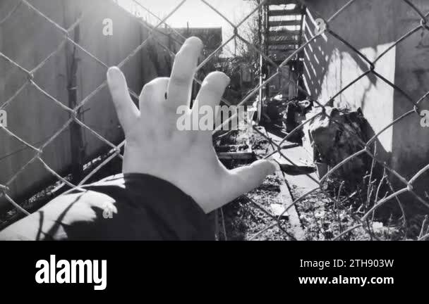 iron grate. steel mesh. the hand is holding the grate. a man's hand ...