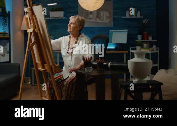 Old artist using vase model to draw authentic masterpiece on canvas ...