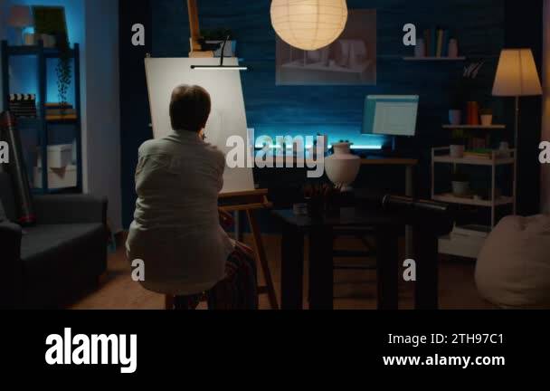 Old person drawing inspiration model with pencils on canvas, using ...