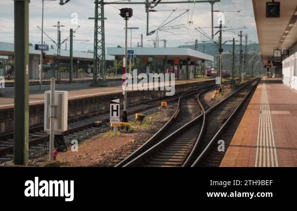 Train pulling into train station. Modern passenger train arriving to ...