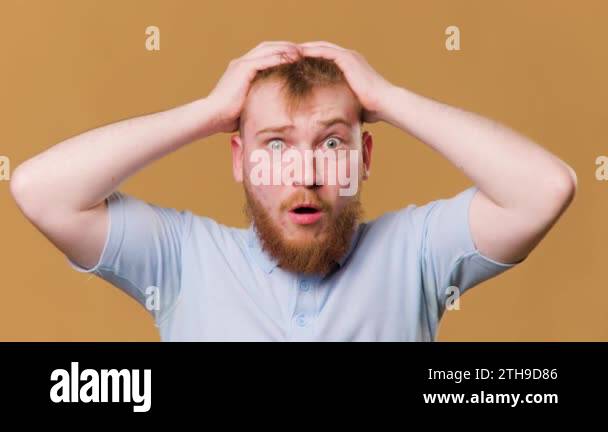 This young adults facial expression is truly remarkable in this studio ...