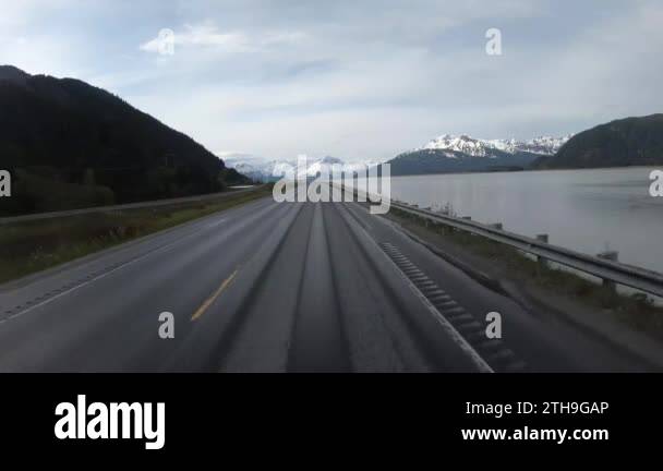Driving through the Turnagain Pass of the Chugach State Park; driving ...