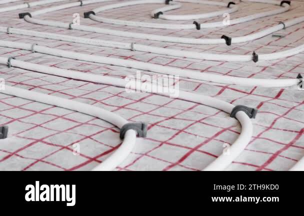 Installation of underfloor heating pipes for water heating. Heating systems. Pipes for ...