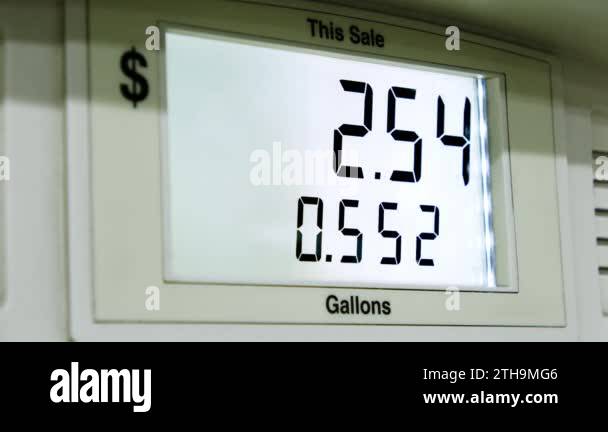 4k footage corner frame the increase in the price per gallon on the ...