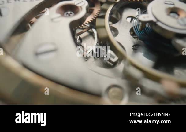 Moving metal gears inside working pocket watch mechanism. Working clock ...