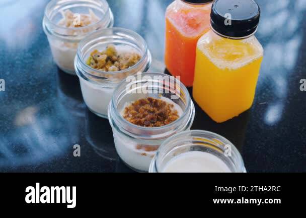 Healthy food. Two bottles of fresh squeezed juices and selection of ...