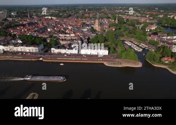 Medieval city seen from above with inland shipping large cargo vessel ... Medieval city seen from above with inland shipping large cargo vessel ...