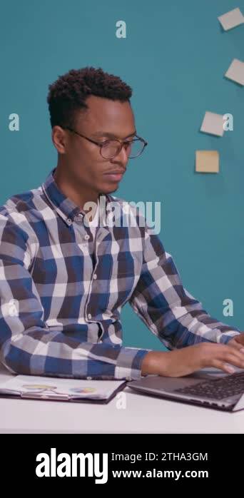 Vertical video: Financial analyst giving thumbs up for work in front of ...