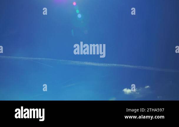 Airplanes are producing contrails in the sky. A contrail is a trail of ...