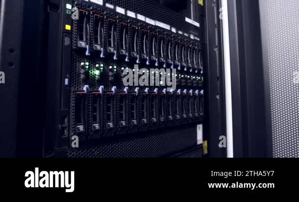 Dark server room in a modern data center. Powerful servers, looped. Working data center with ...