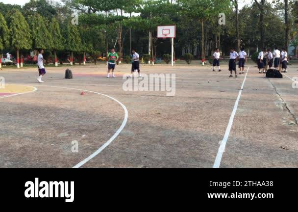 Unidentified students playing cricket at the Dhaka Residential Model ...