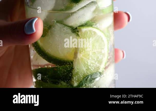 Cold lemonade mojito cocktail carbonated drink. Closeup refreshing soda tonic fizzy sparkling ...