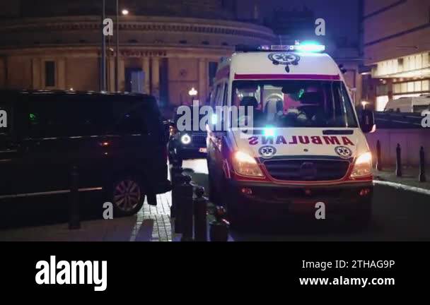 Ambulance vehicle with flashers at the parking lot at night in old ...