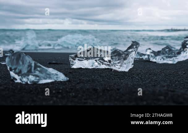 Close-up of beautiful iceberg on black sand at Diamond beach in Iceland ...