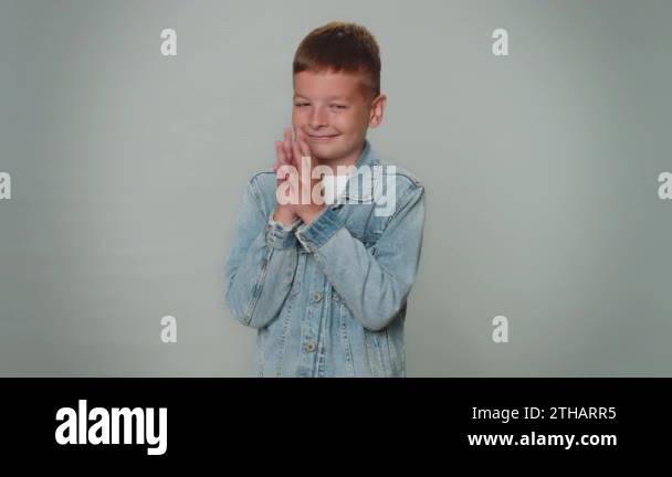 Sneaky cunning boy with tricky face gesticulating and scheming evil ...