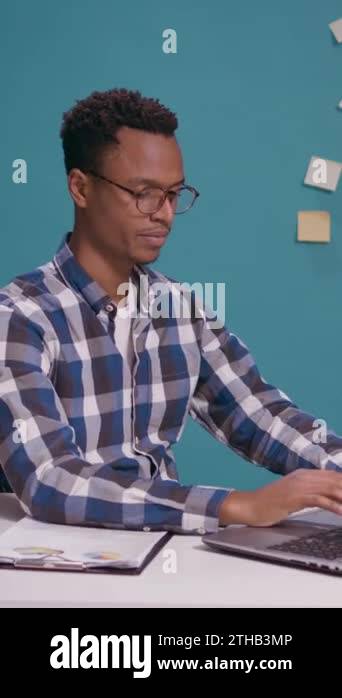 Vertical video: Office worker doing military salute to show respect and ...