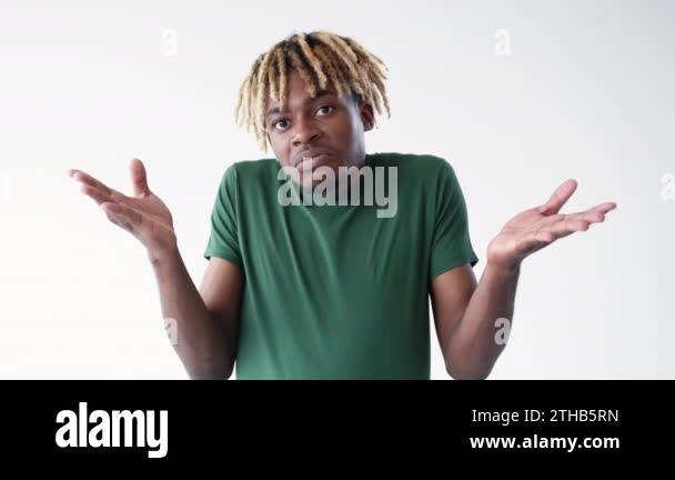 No idea. Black man. Meme expression. Hesitating hipster guy shrugging ...