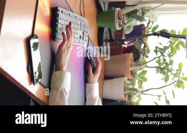 Beautiful female hands and keyboard. A woman works at a computer ...