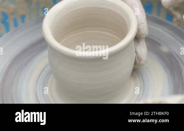 Clay modeling master class. Potter male hands shape and sculpt the soft ...