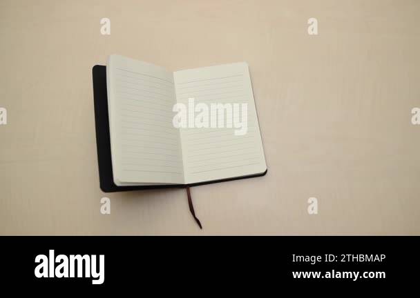 Table book Stock Videos & Footage - HD and 4K Video Clips - Alamy