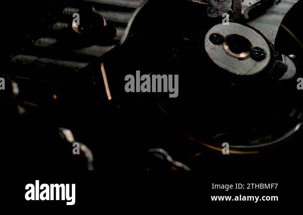 Disassembled vintage pocket watch with clockwork turning. Working clock ...