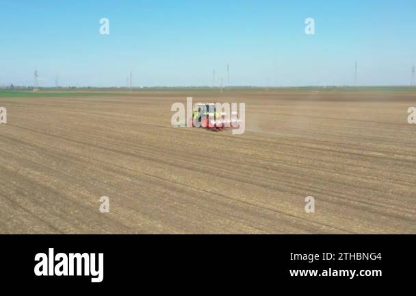 Above rotation view, orbit dolly move, of tractor as pulling mechanical ...