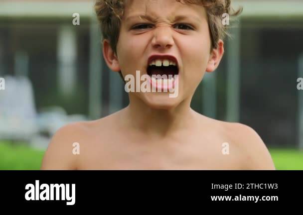 Child boy screaming from top of his lungs in slow-motion 120fps. Kid ...