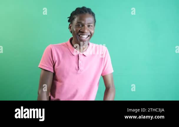 Laughter of young man in pink t-shirt, image of male model laughing ...