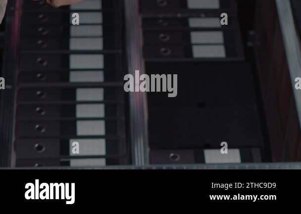 Vertical video: Law officer examining physical evidence in case files ...