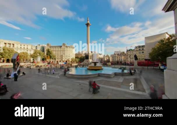 Time-lapse of Trafalgar Square in London. People walk around the ...