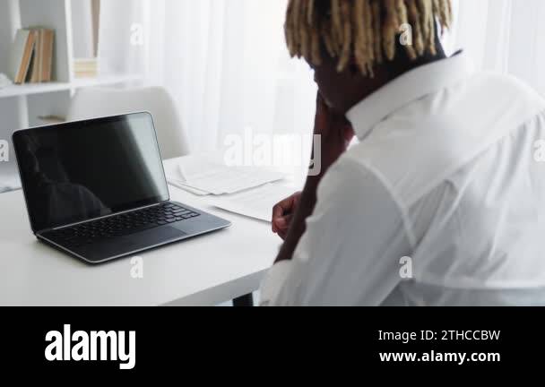 Hard work. Displeased man. Virtual conference. Unhappy tired black guy ...