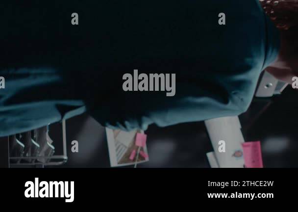 Vertical video: Inspector conducting criminal investigation in archive ...