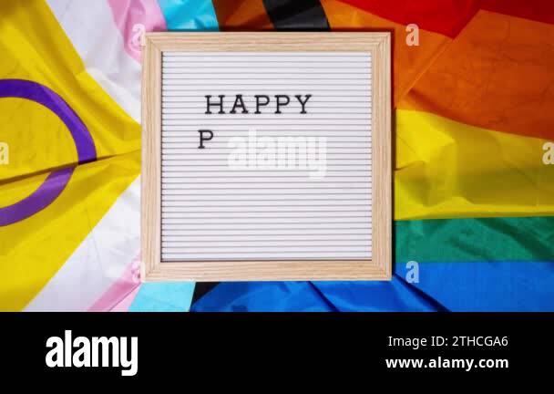Stop motion HAPPY PRIDE MONTH frame on Rainbow LGBTQIA flag made from ...