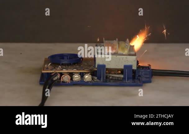 The wiring in the electrical board with the power supply is lit and ...