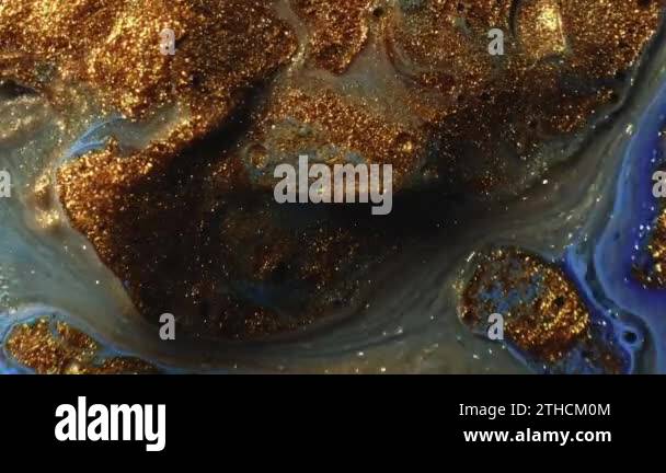 Glitter paint. Ink flow. Fluid mix. Sparkling bronze brown blue color ...