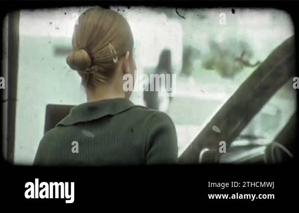 Young woman bank teller at drive through window of bank next to cash ... Young woman bank teller at drive through window of bank next to cash ...