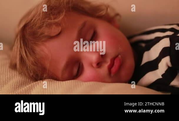 Young boy sleeping at night, close-up of baby face asleep in sofa Stock ...