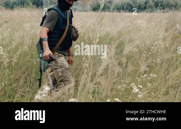 Using a mine detector, minesweeper using a mine detonator, outdoors ...