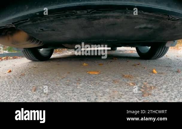 The car drives on a rough road crossing pits and potholes. The concept ...