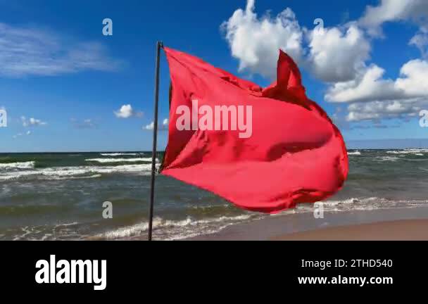 Danger: Red flag is warning about the prohibition of swimming on the ...