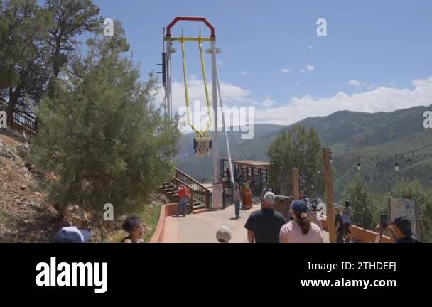 People on and around the Giant Canyon Swing at the Glenwood Springs ...